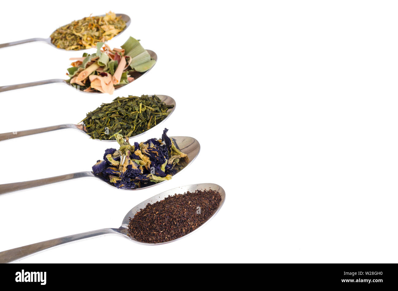Leaves of different varieties of tea in spoons Stock Photo - Alamy