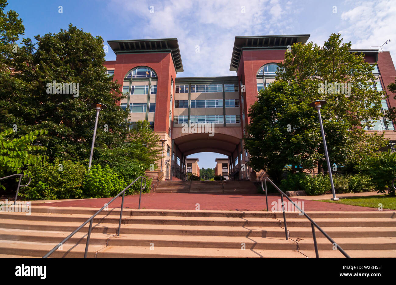 A set of steps leading to a covered walkway between buildings on the ...