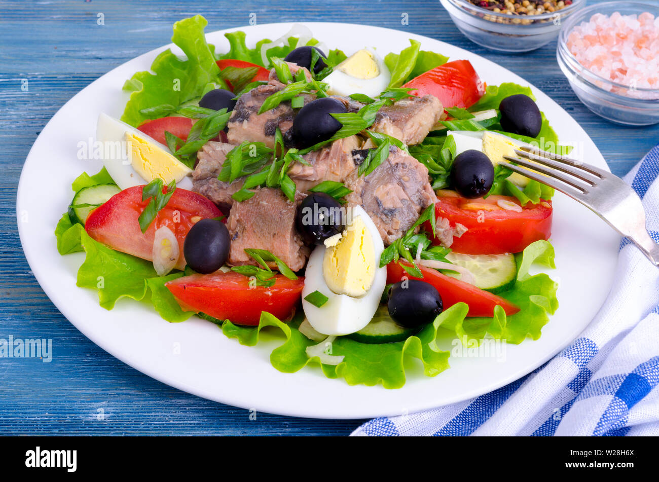 Salad of fresh vegetables, egg, canned fish and olives Stock Photo - Alamy