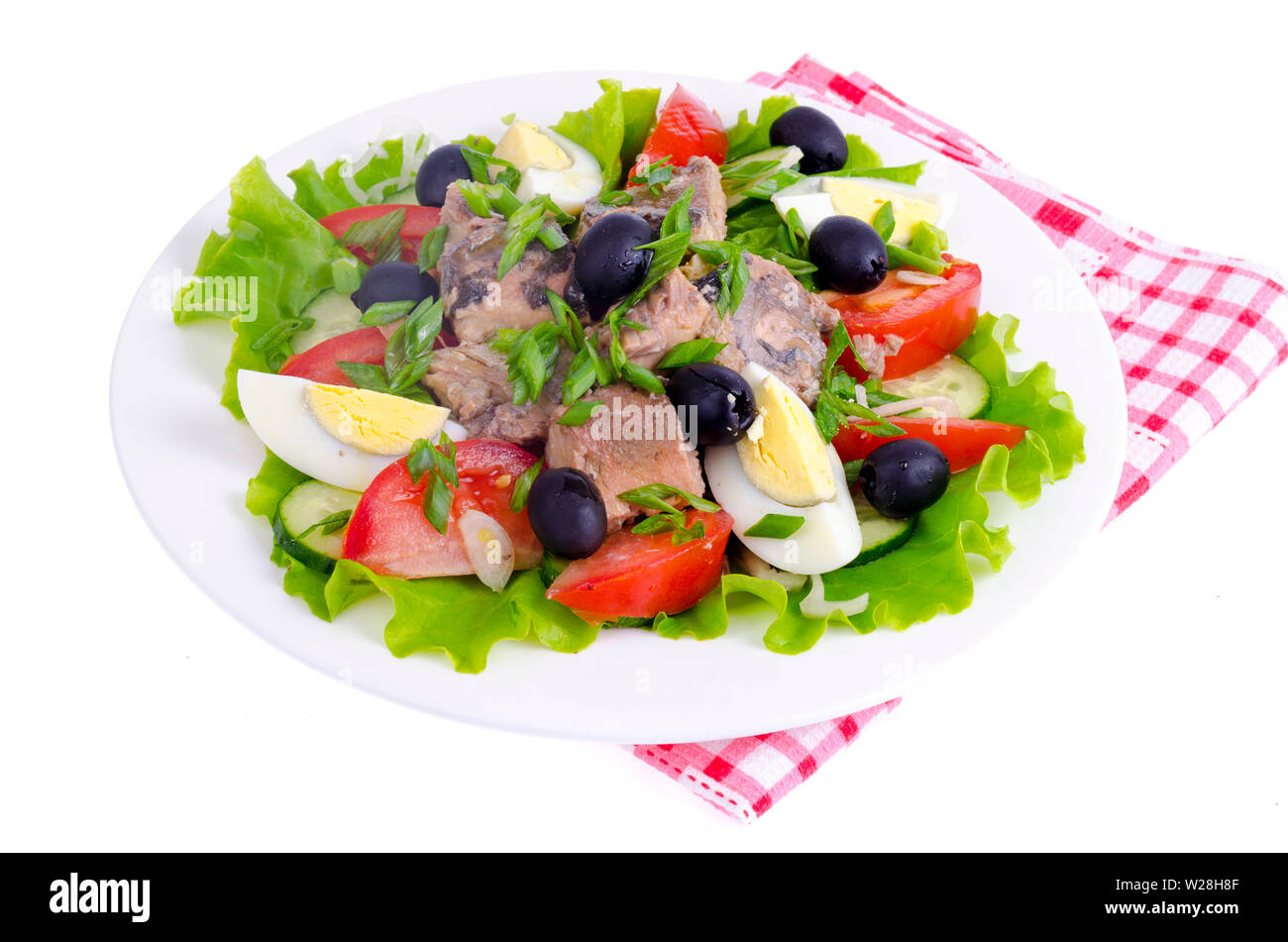 Salad of fresh vegetables, egg, canned fish and olives Stock Photo - Alamy