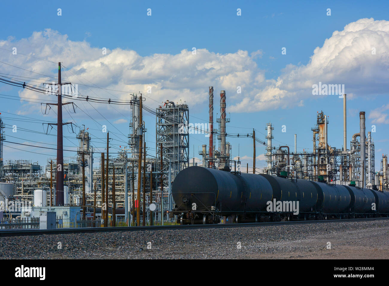 Oil Train on Tracks Next to a Refinery Stock Photo - Alamy