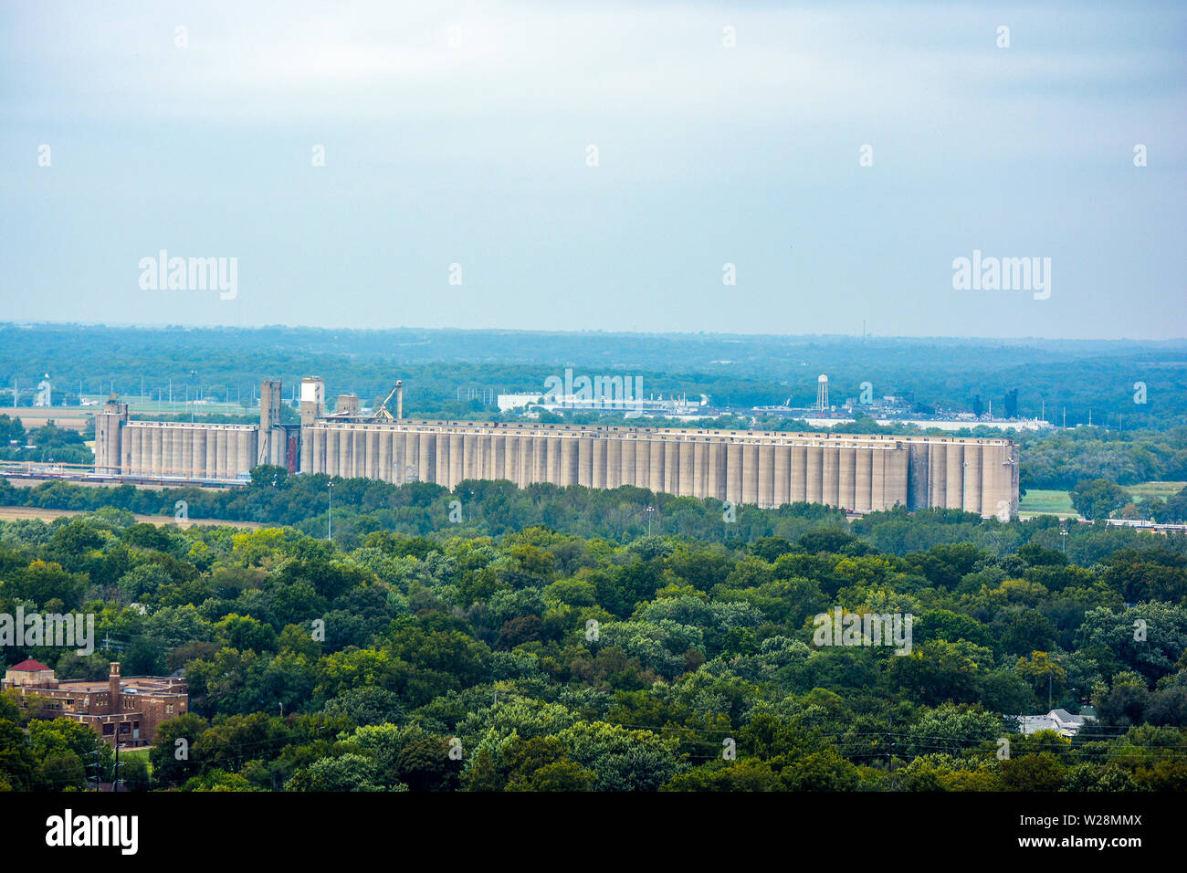 Large Agriculture Grain Elevator Silo Complex with Green trees Stock ...
