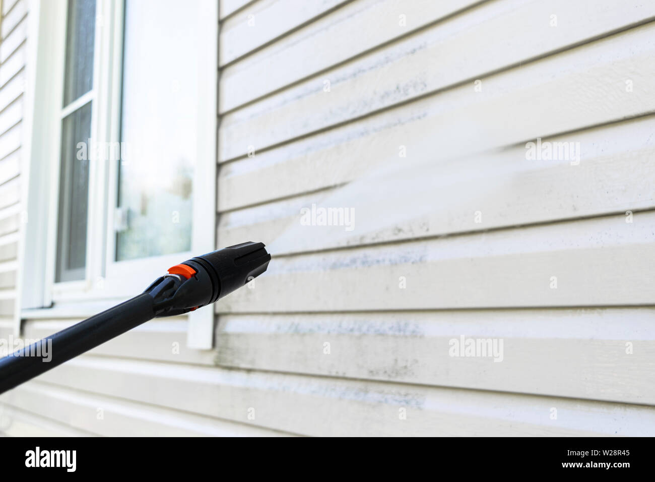 Cleaning service washing building facade with pressure water. Cleaning ...