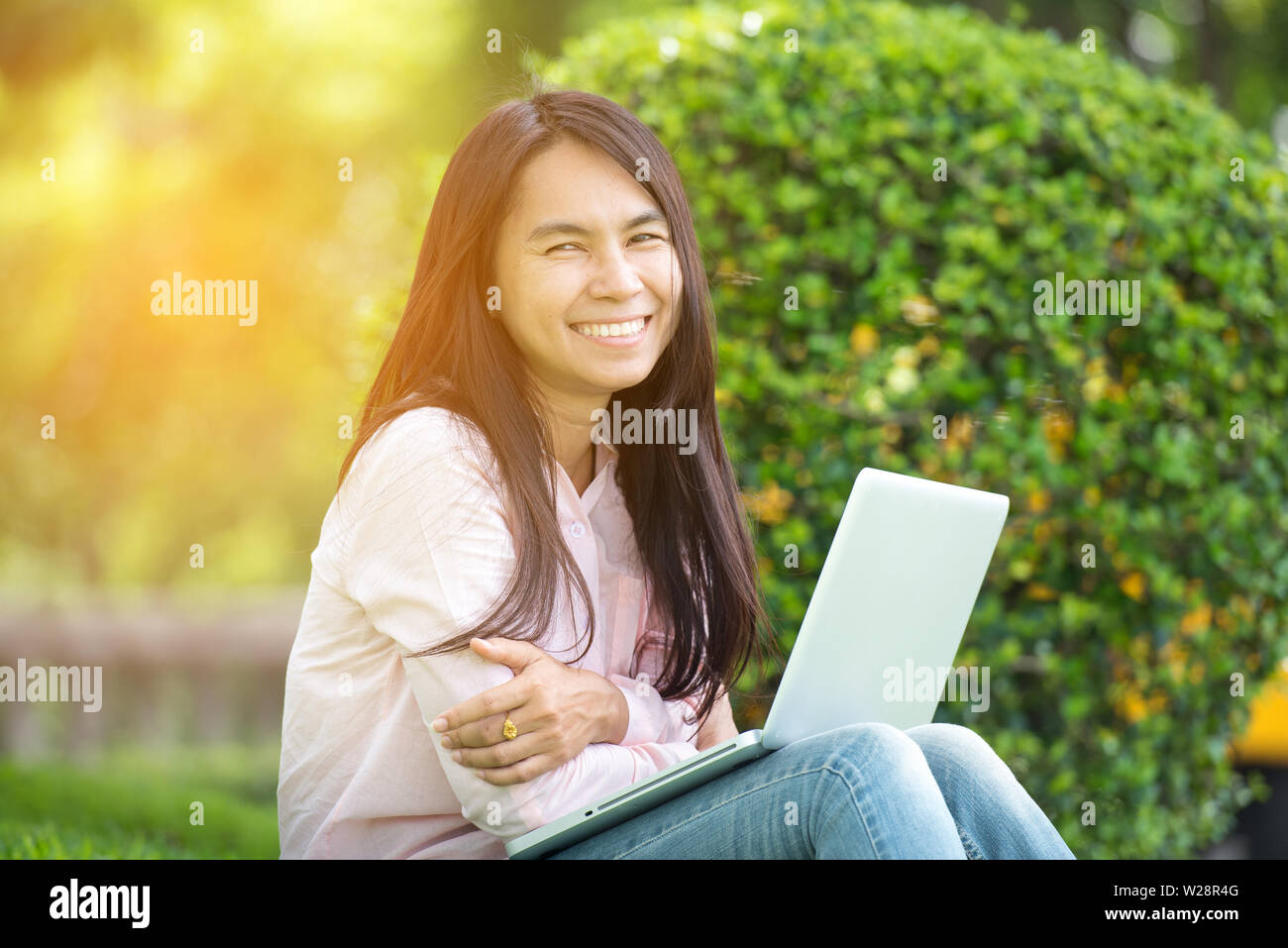 Beautiful business working woman using Iphone Ipad while working with ...