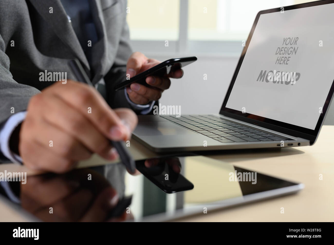 Laptop with blank screen on table. Workspace background new project on ...