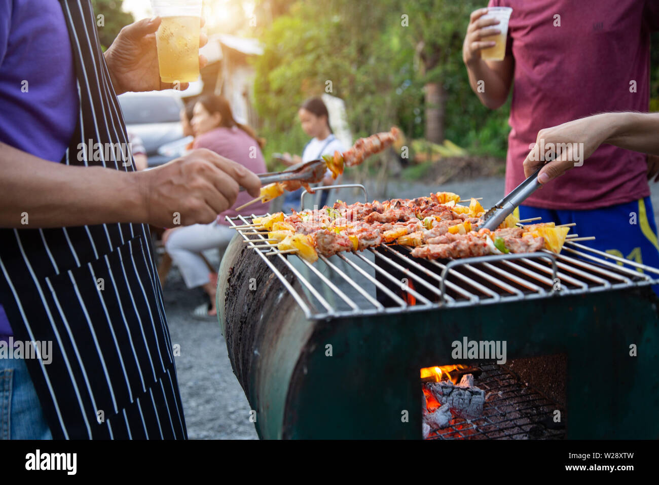 Barbeque Grill Street Food in thailand,Eat outdoors in a happy family ...