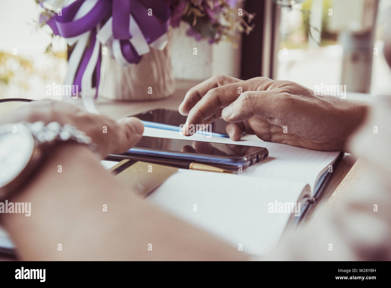 businessman hands searching for data on Notebook with analyzing charts ...