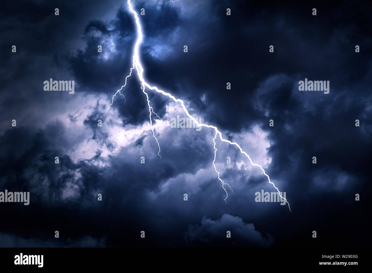 Lightning strike on a cloudy dark sky Stock Photo - Alamy