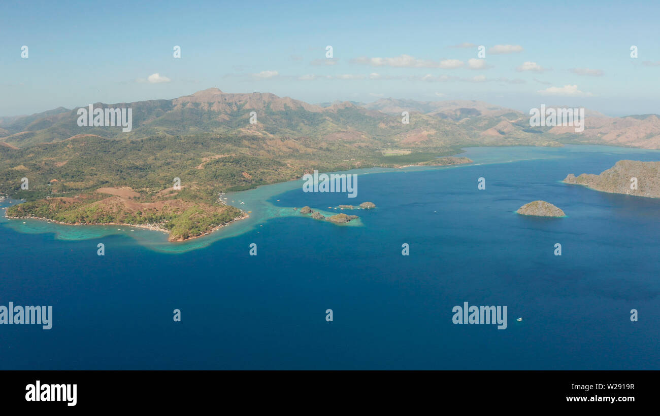 Aerial tropical landscape, lagoon with blue water and mountains of ...