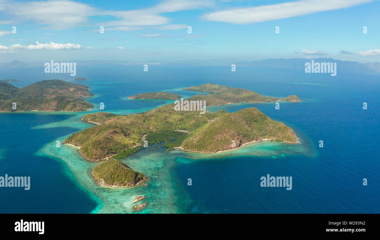 aerial view tropical islands with blue lagoons, coral reef and sandy ...