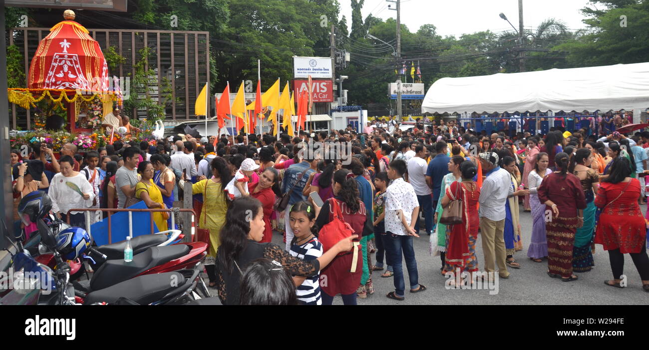 A large crowd of people wait to join a colourful parade by The ...