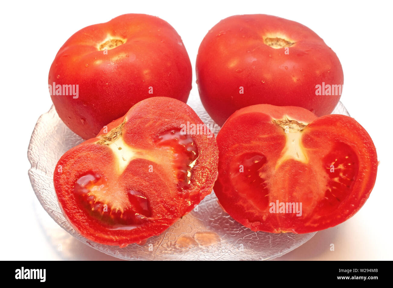 Red ripe tomatoes isolated on white background Stock Photo - Alamy