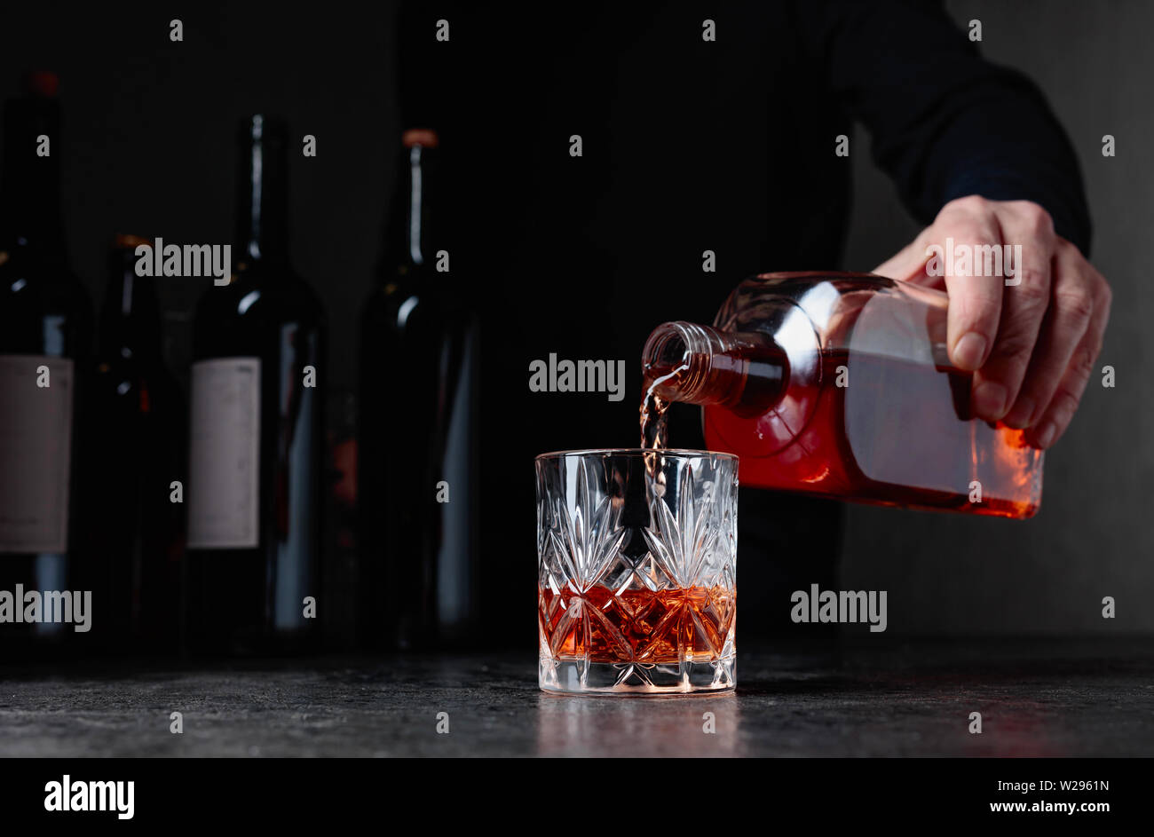 Barman pours alcoholic drink hi-res stock photography and images - Alamy