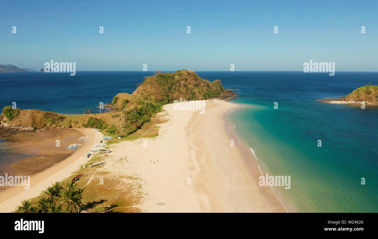 Blue sea and tropical beach, aerial drone. Nacpan, El Nido, Palawan ...