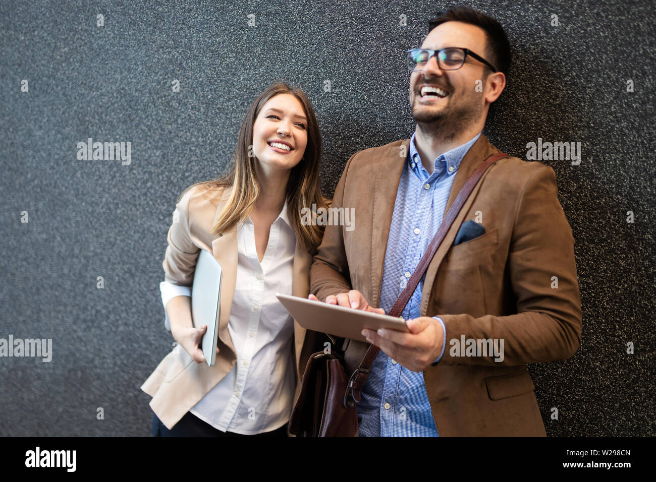 Portrait of happy business friends enjoying the break from meeting ...