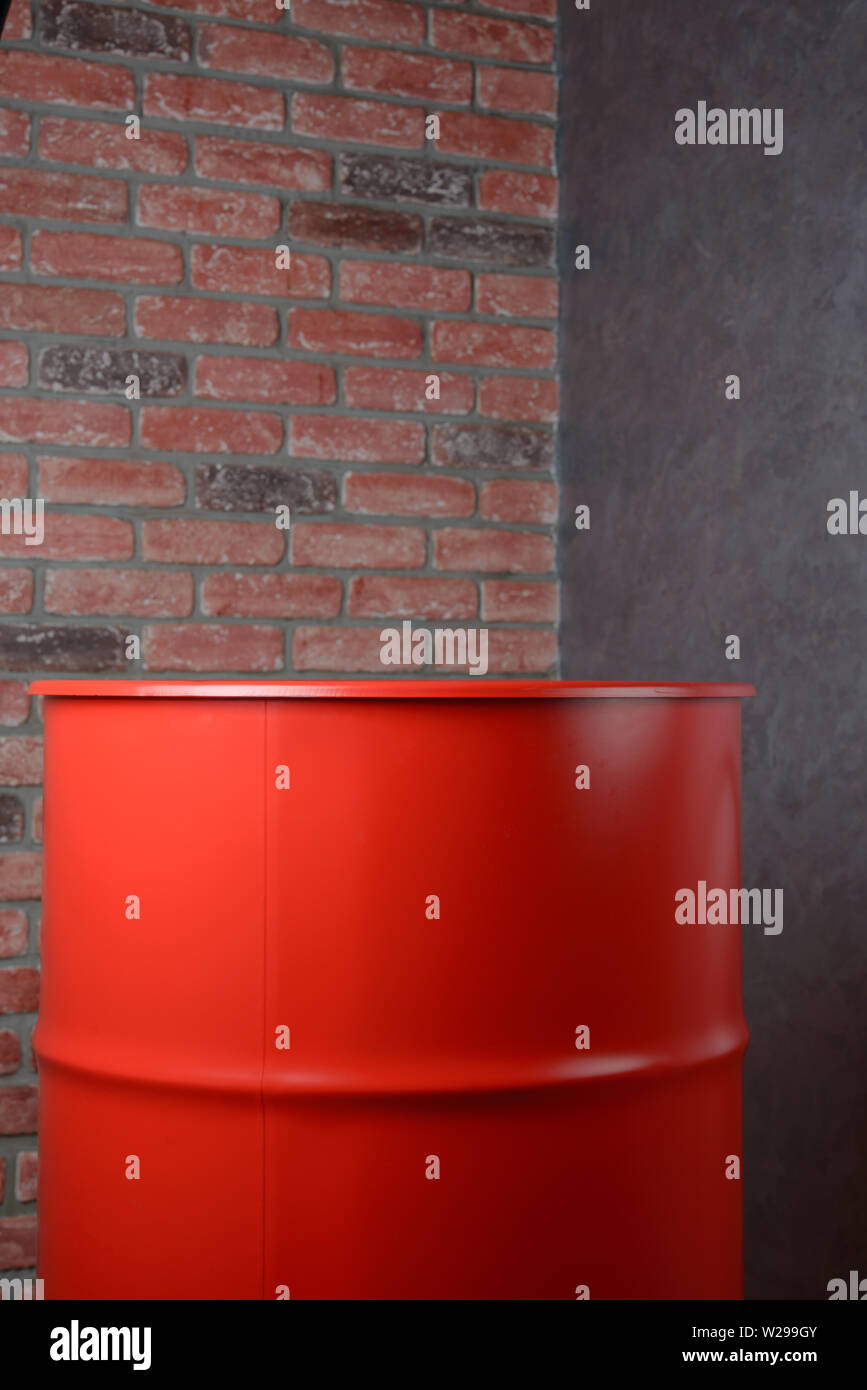 Large Iron Red Barrel on a brick wall background Stock Photo - Alamy