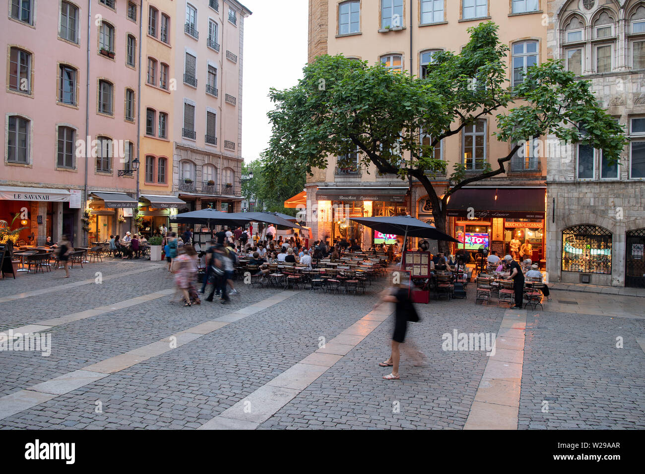 05 July 2019, France (France), Lyon: People walk through the district ...