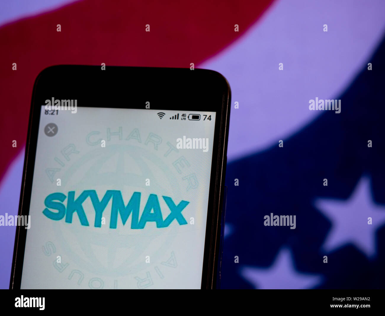 In this photo illustration the Skymax Air Charter and Air Tours logo is seen displayed on a ...