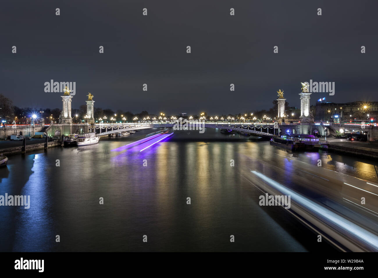 Pont Alexandre III in Paris at night. This bridge is one of the most ...