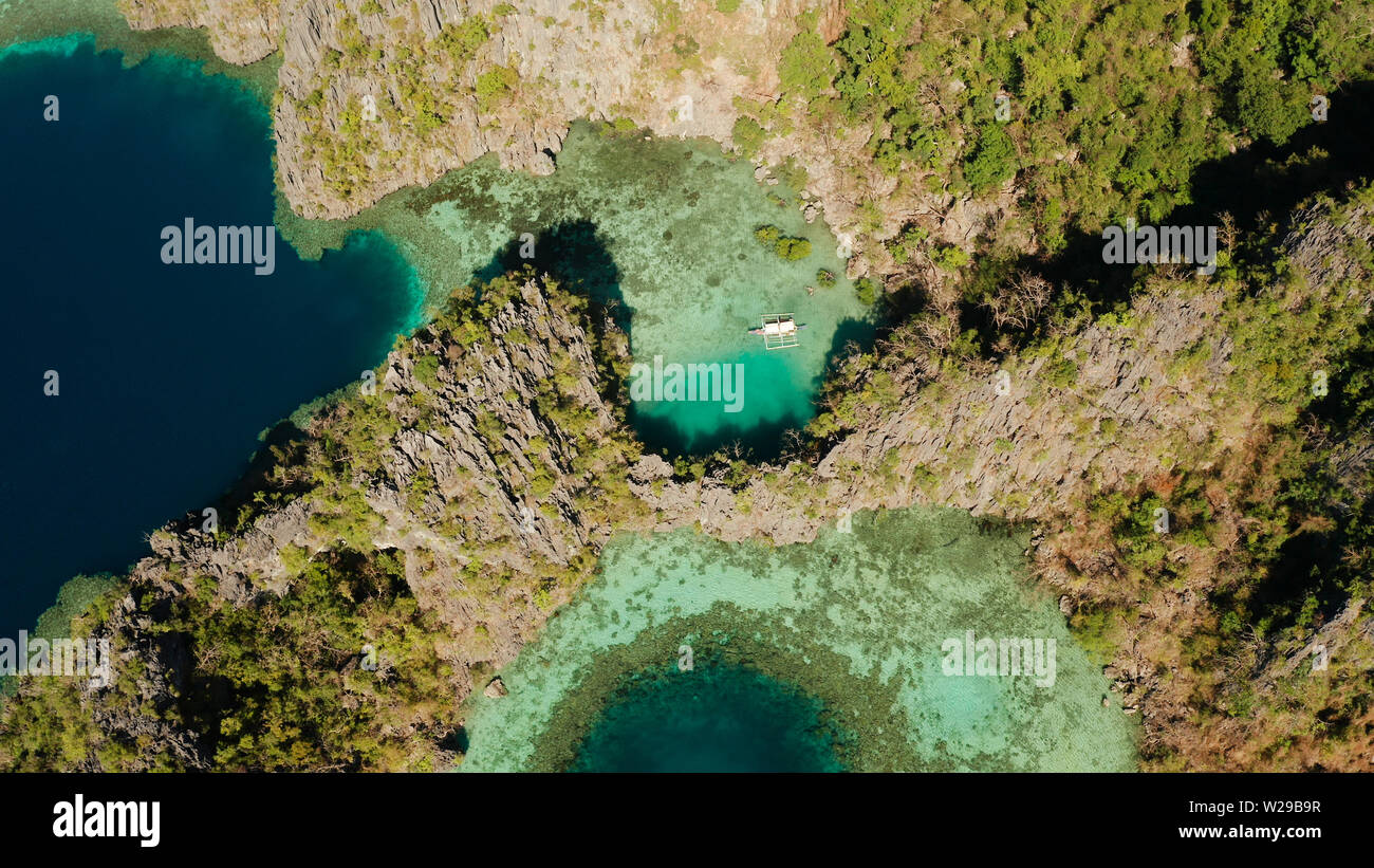 Aerial tropical landscape blue lagoon surrounded by rocks on tropical ...