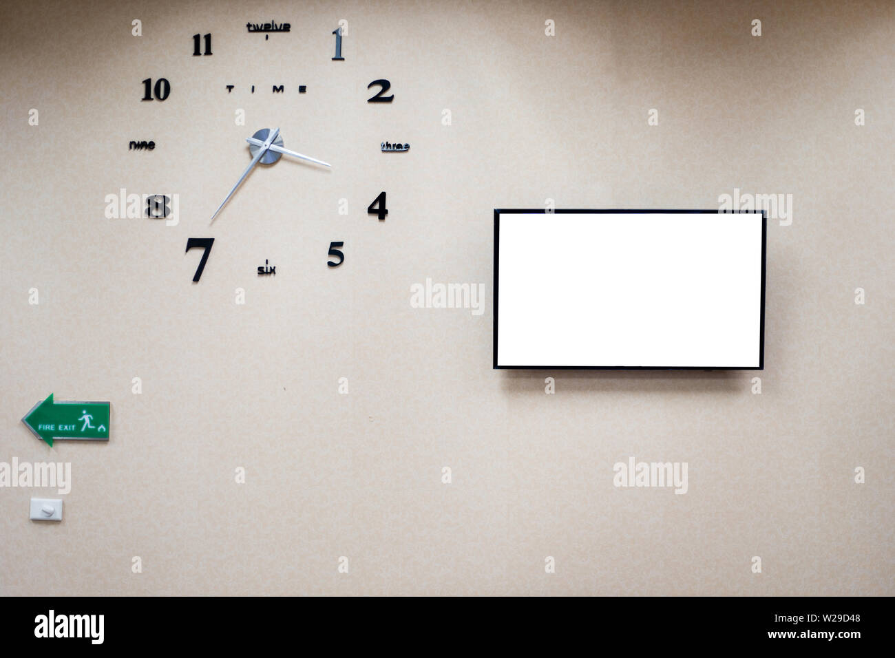 Fire exit sign on wall, fire escape standard sign in building and ...