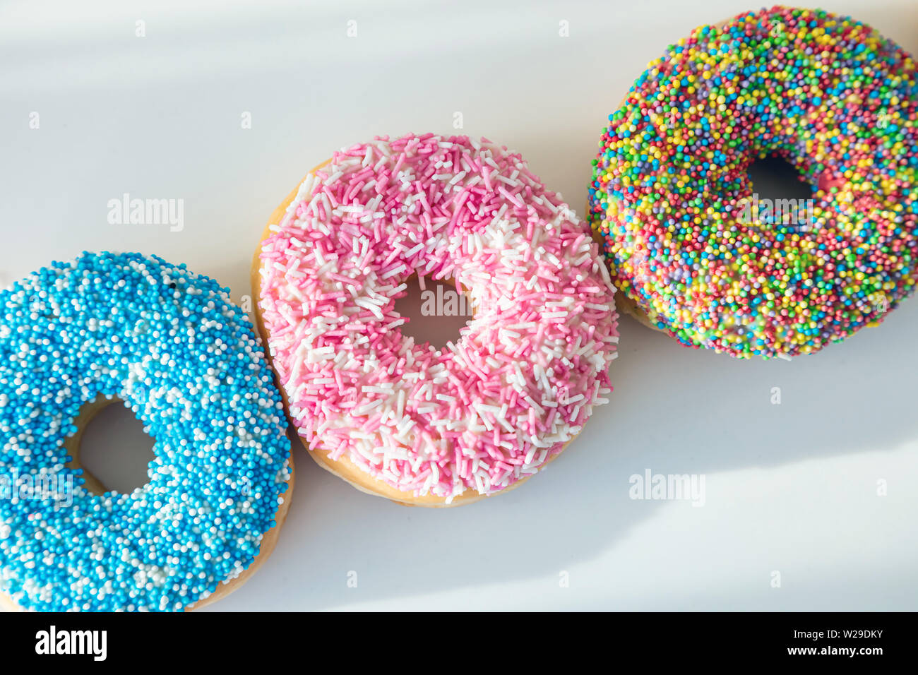 Assorted donuts. Colorful donuts assortment on white color background ...