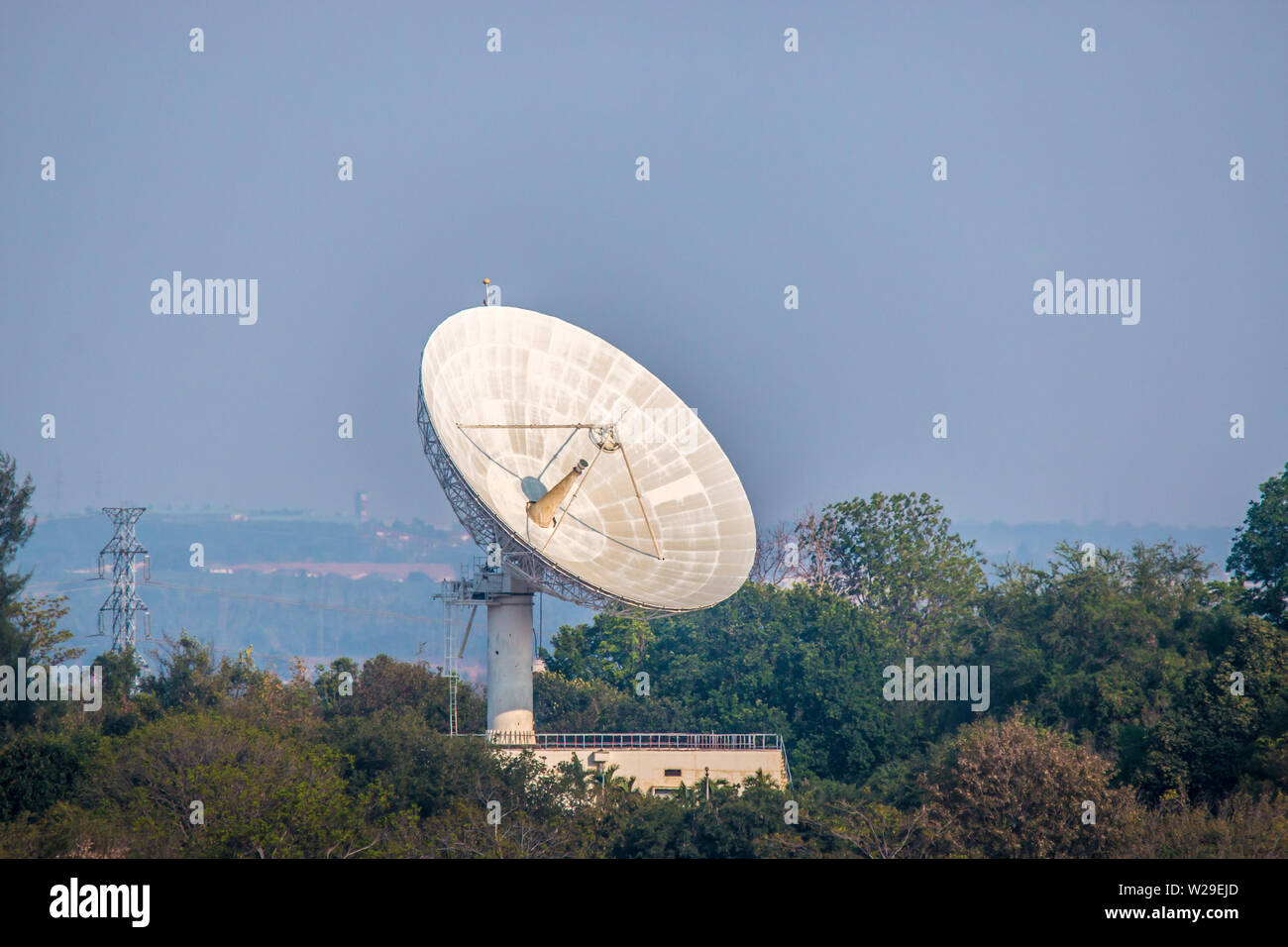 The Large satellite dish on the forest over clouded background Stock ...