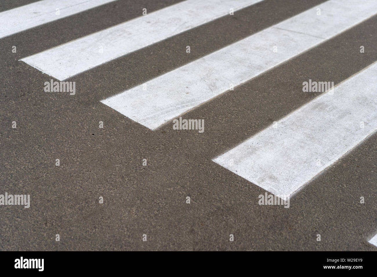 Pedestrian crossing, asphalt road top angle view. Background with free ...