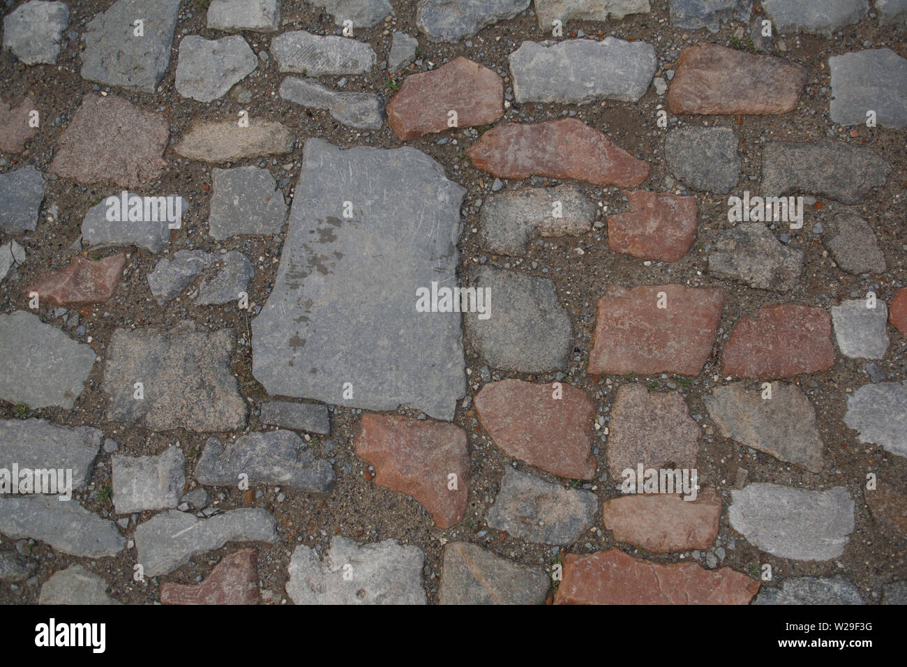 old vintage cobbled road texture background Stock Photo - Alamy
