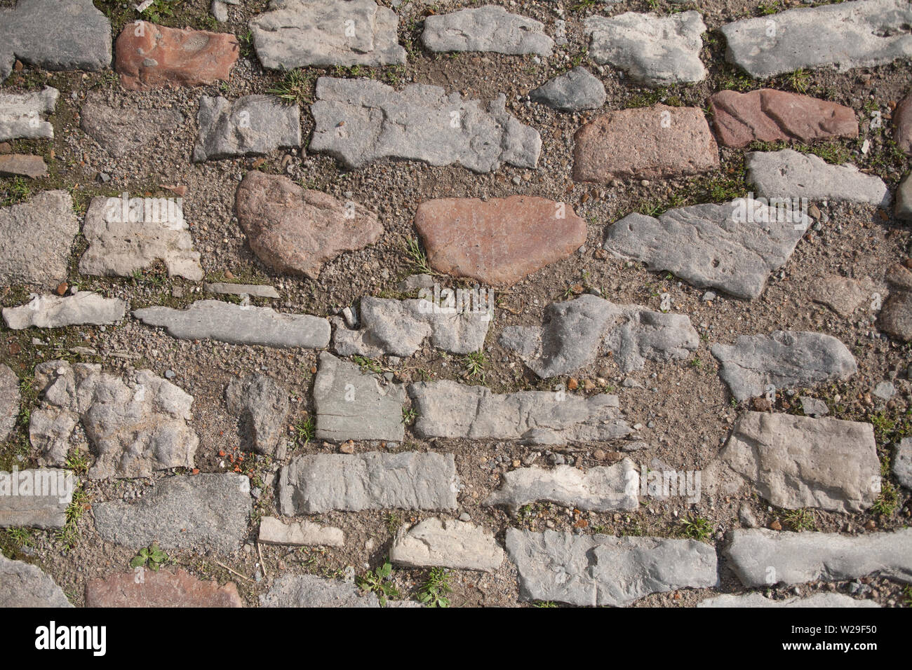 old vintage cobbled road texture background Stock Photo - Alamy
