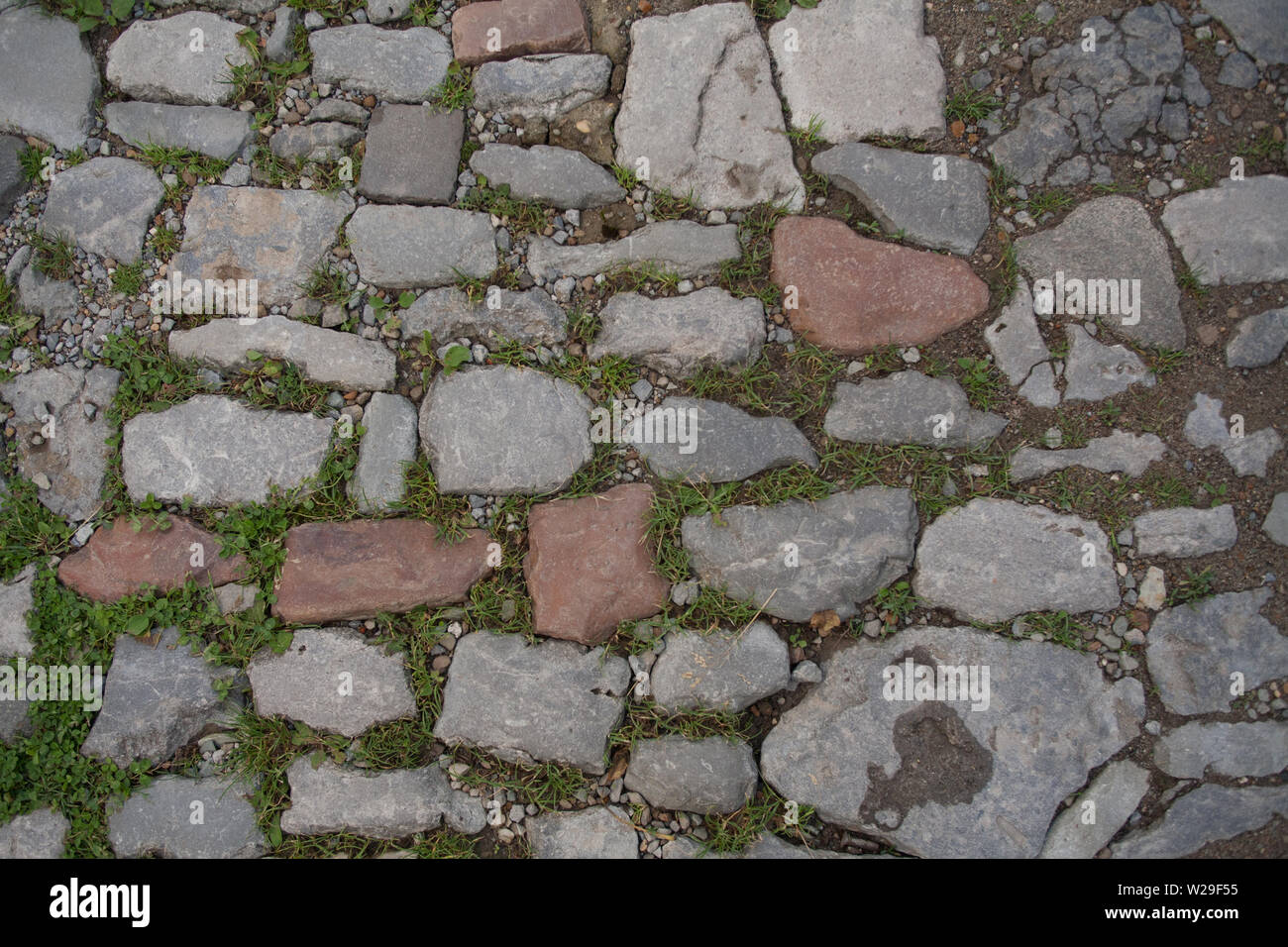 old vintage cobbled road texture background Stock Photo - Alamy