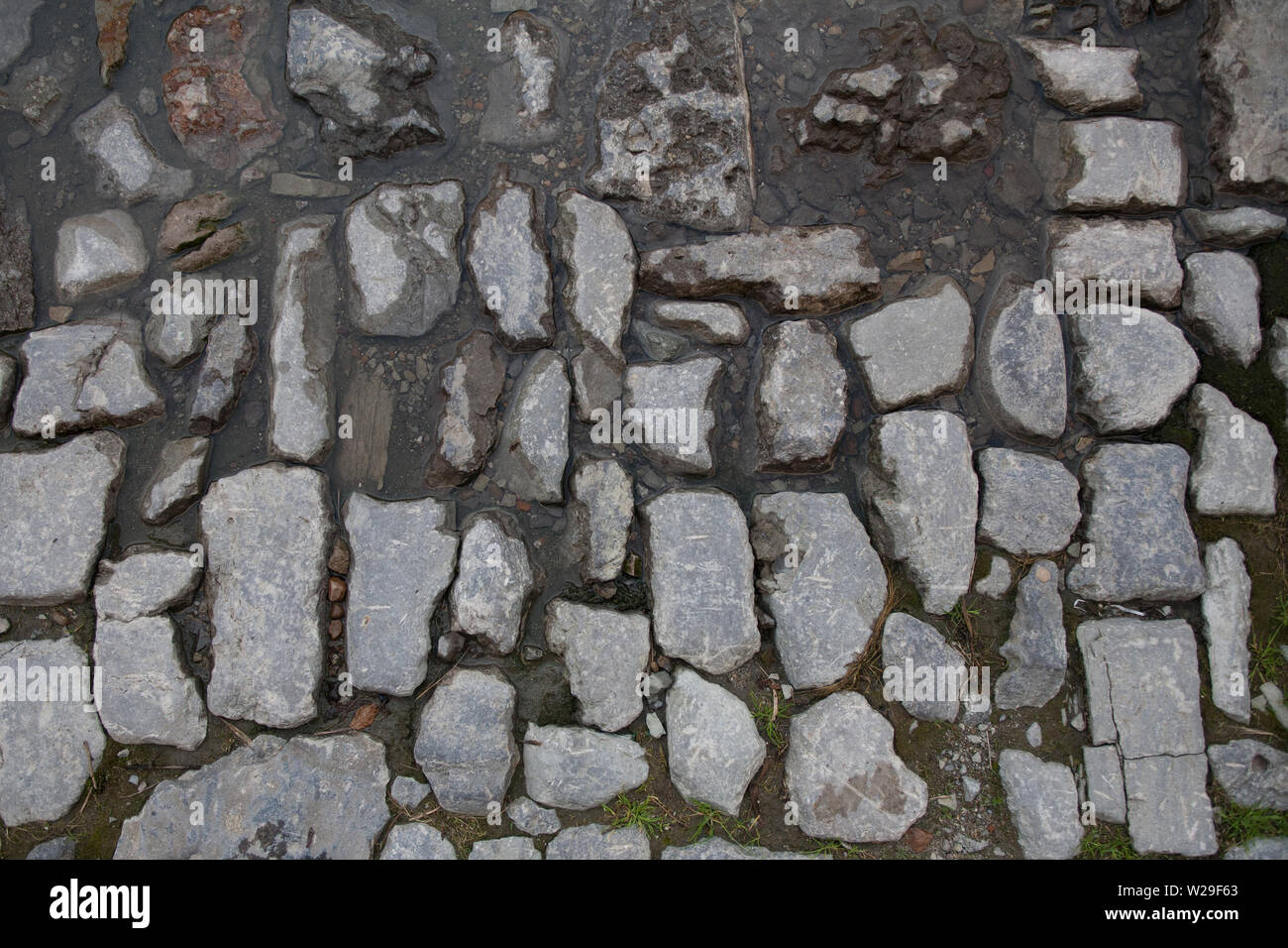 old vintage cobbled road texture background Stock Photo - Alamy