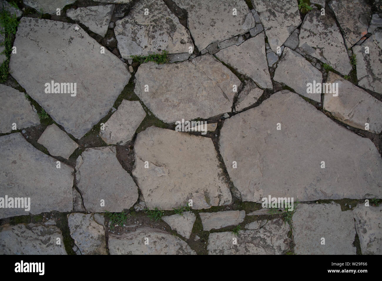 old vintage cobbled road texture background Stock Photo - Alamy