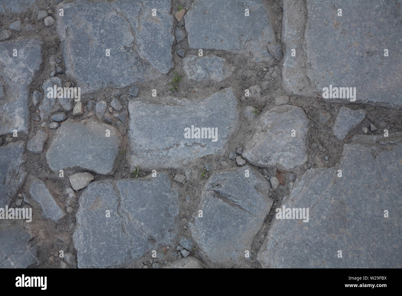 old vintage cobbled road texture background Stock Photo - Alamy