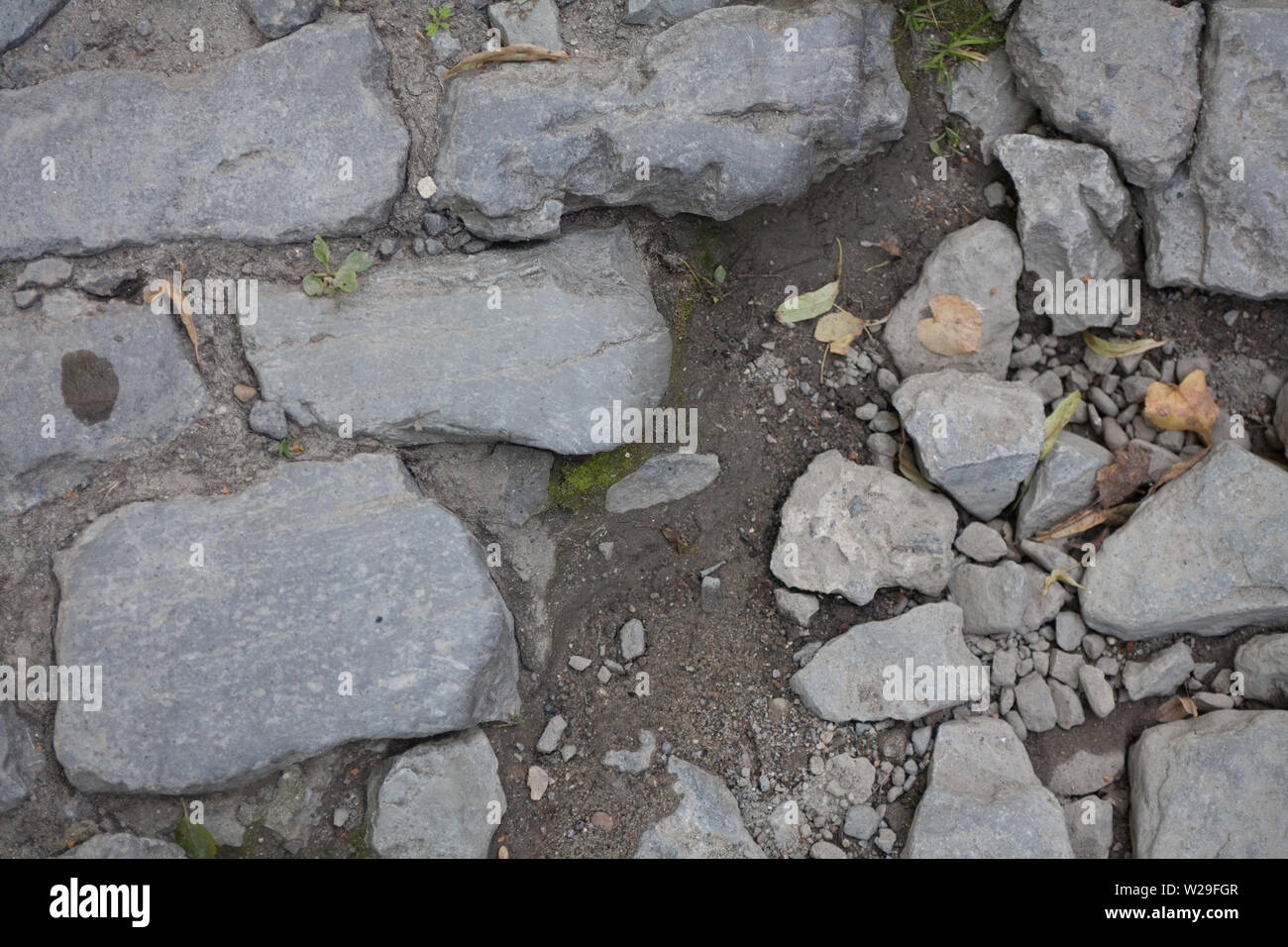 old vintage cobbled road texture background Stock Photo - Alamy