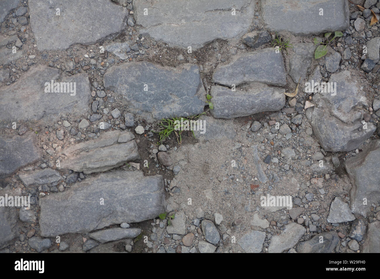 old vintage cobbled road texture background Stock Photo - Alamy
