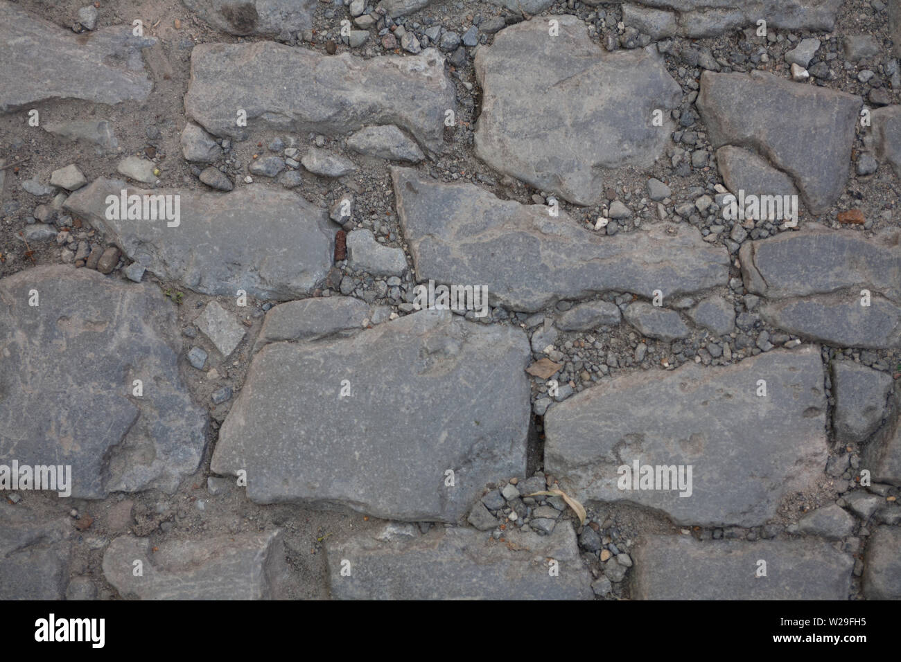 old vintage cobbled road texture background Stock Photo - Alamy