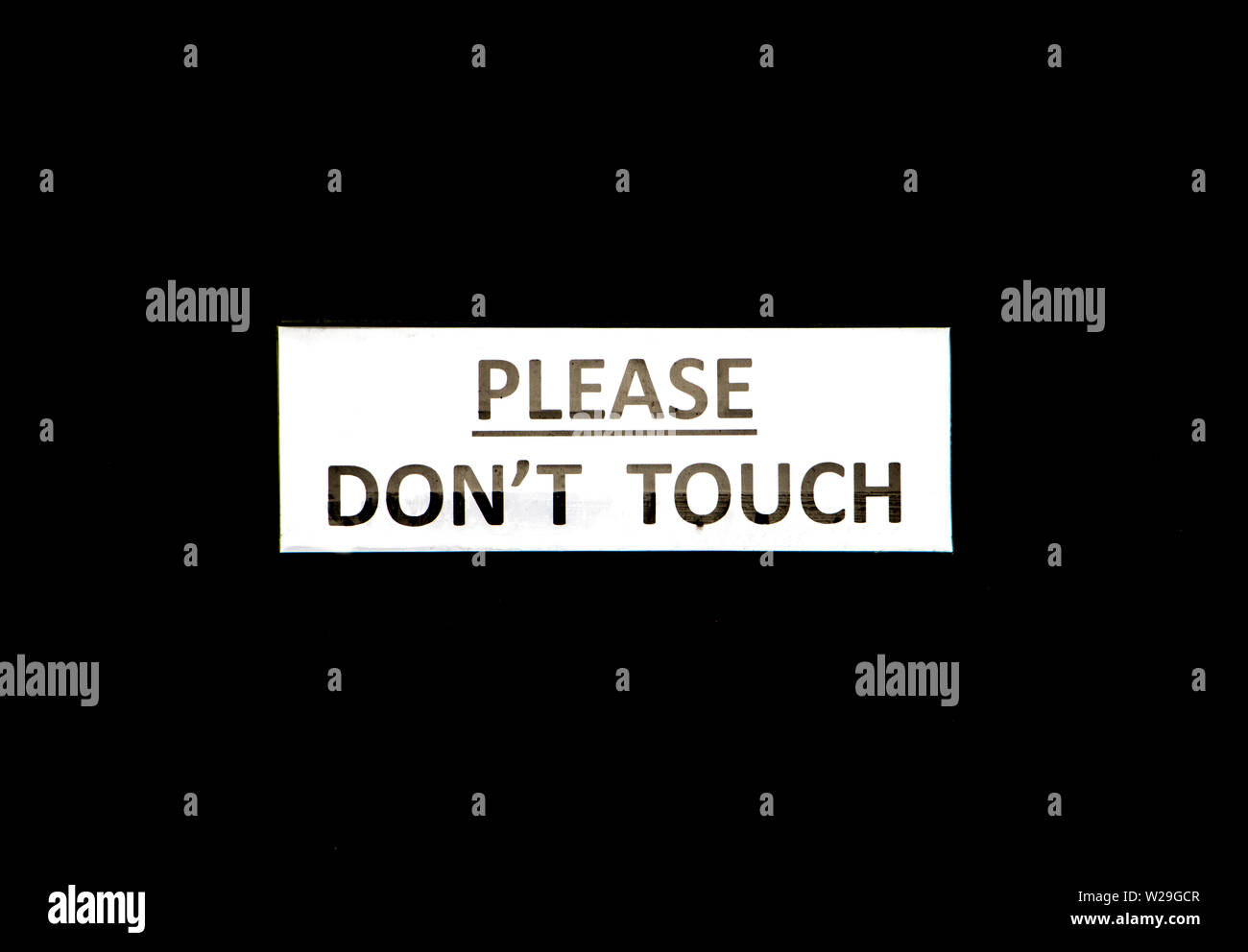 Do not touch signboard with on black background Stock Photo - Alamy