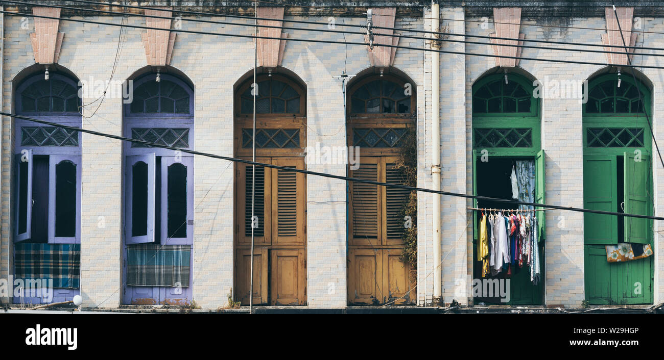 Colonial style balcony doors and windows in Yangon old town district ...