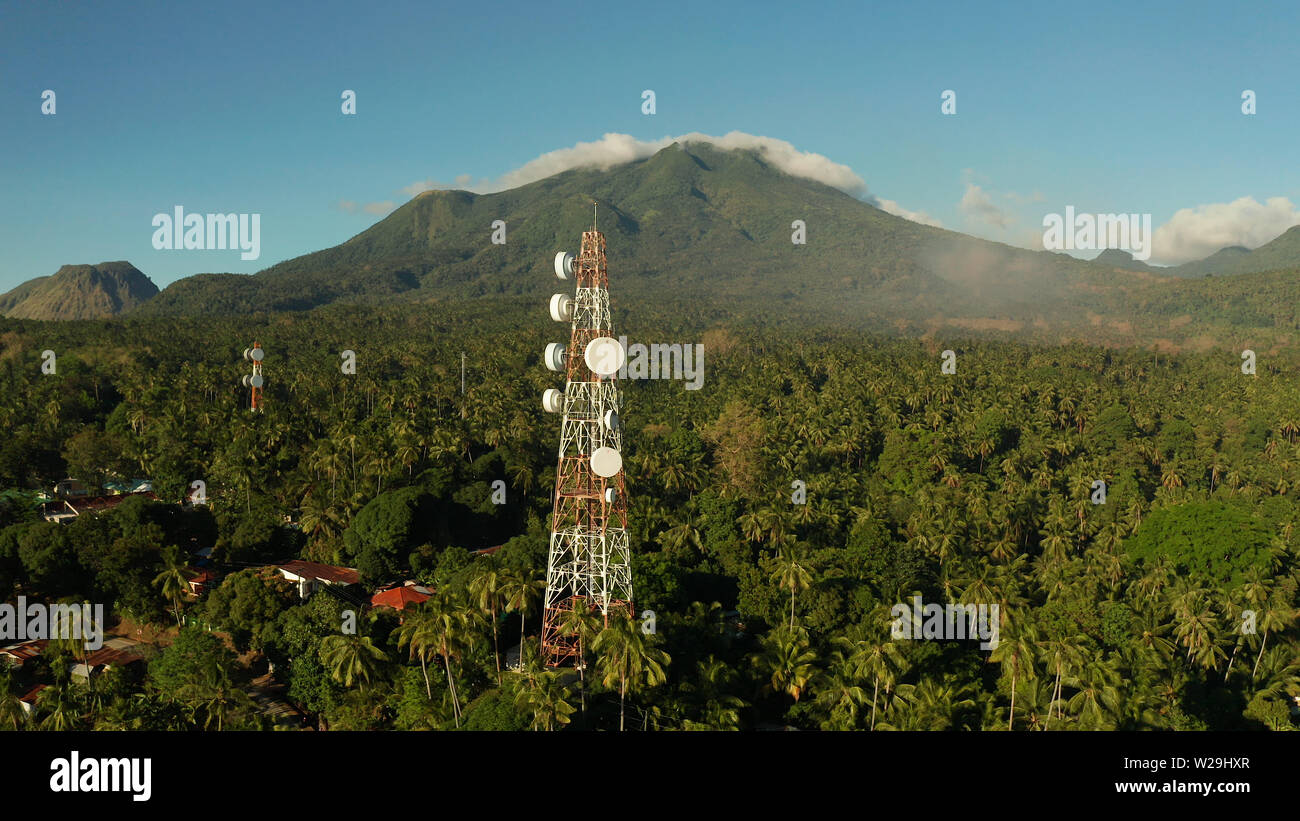 Telecommunication tower, communication antenna against mountains and ...