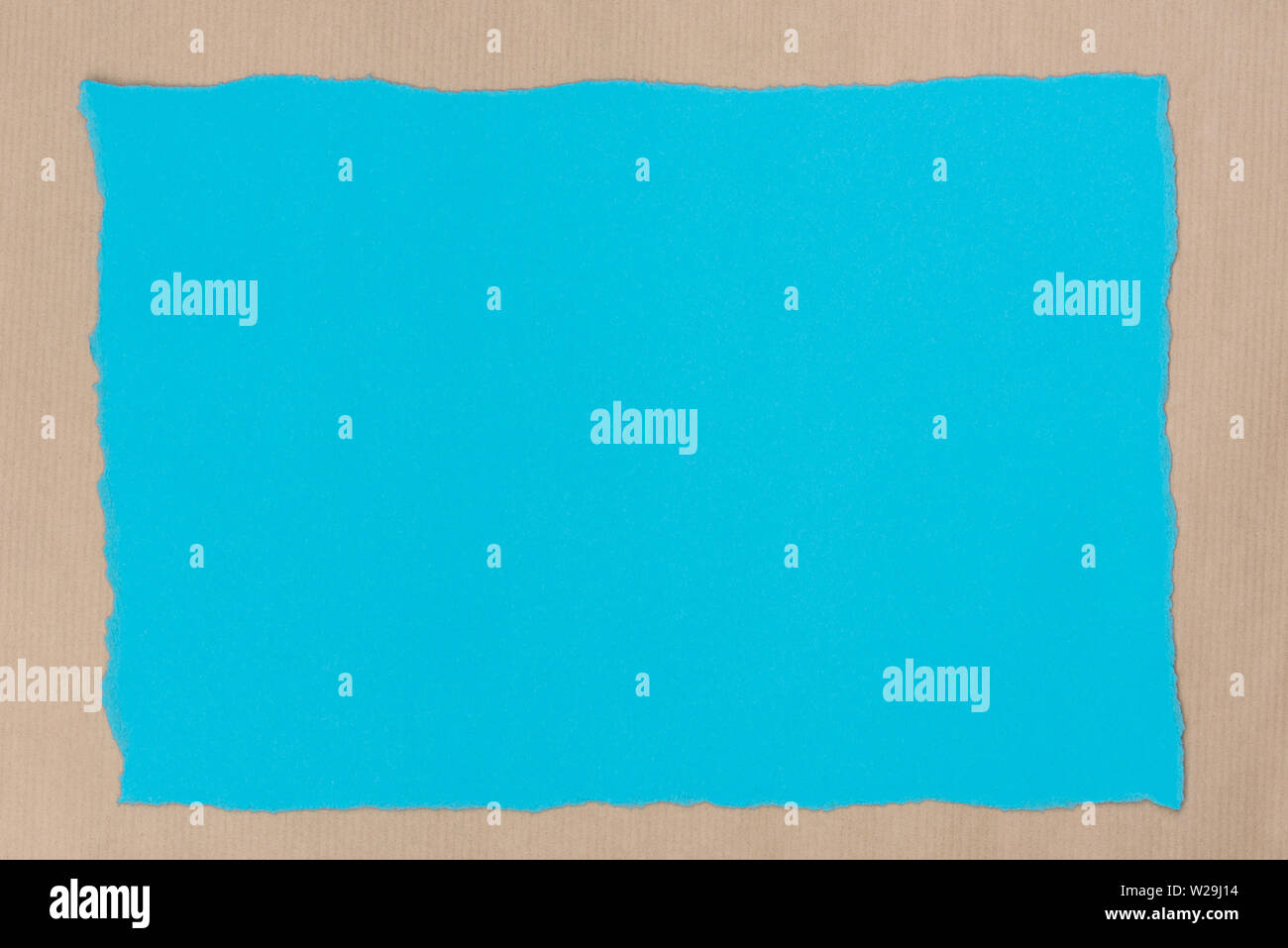 blue color piece of torn paper on recycled paper background texture ...
