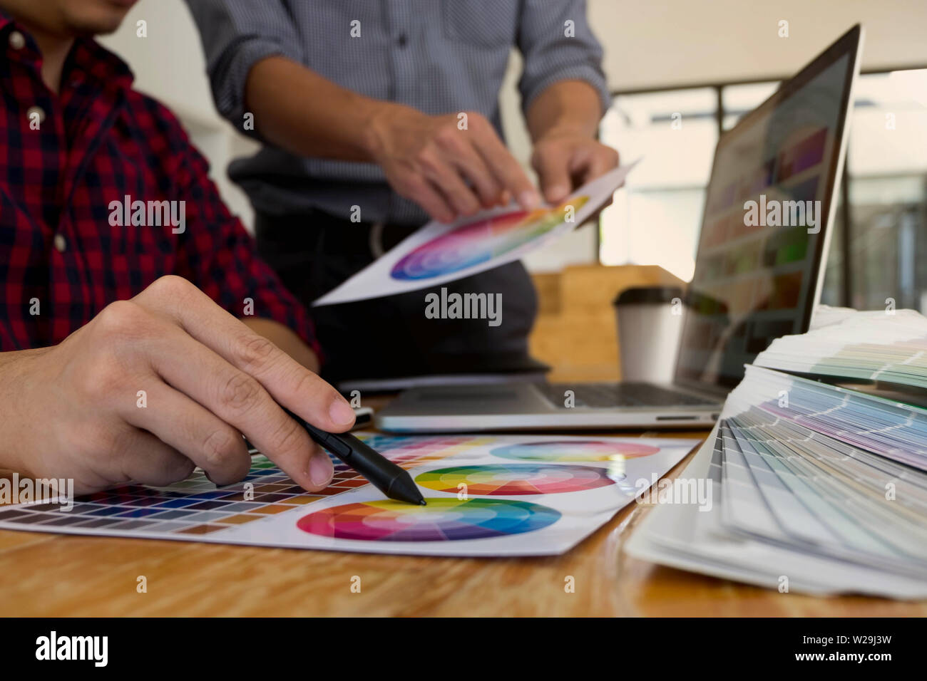 Graphic designers choose colors from the color bands samples for design ...