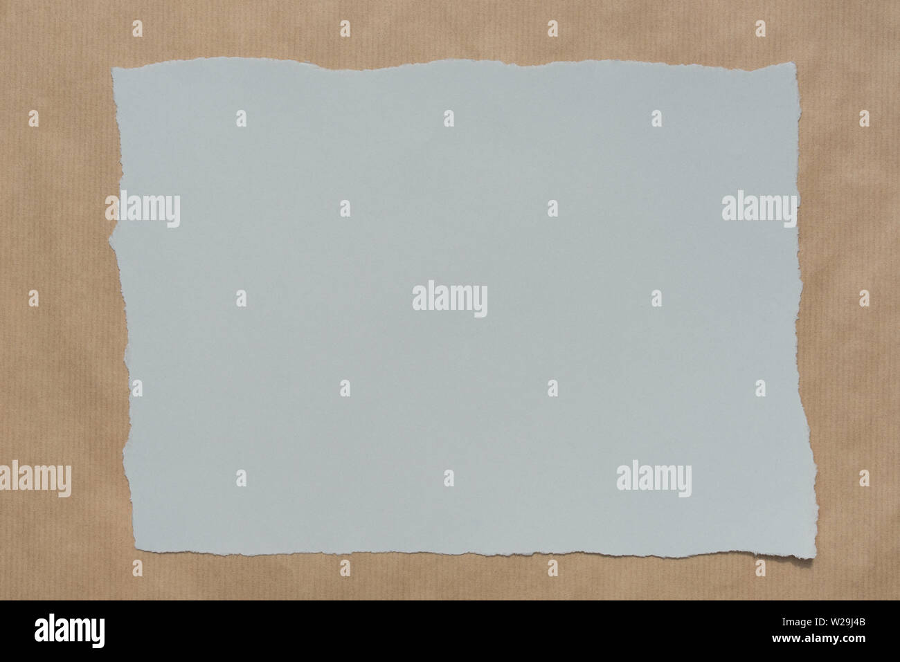 gray color piece of torn paper on recycled paper background texture ...