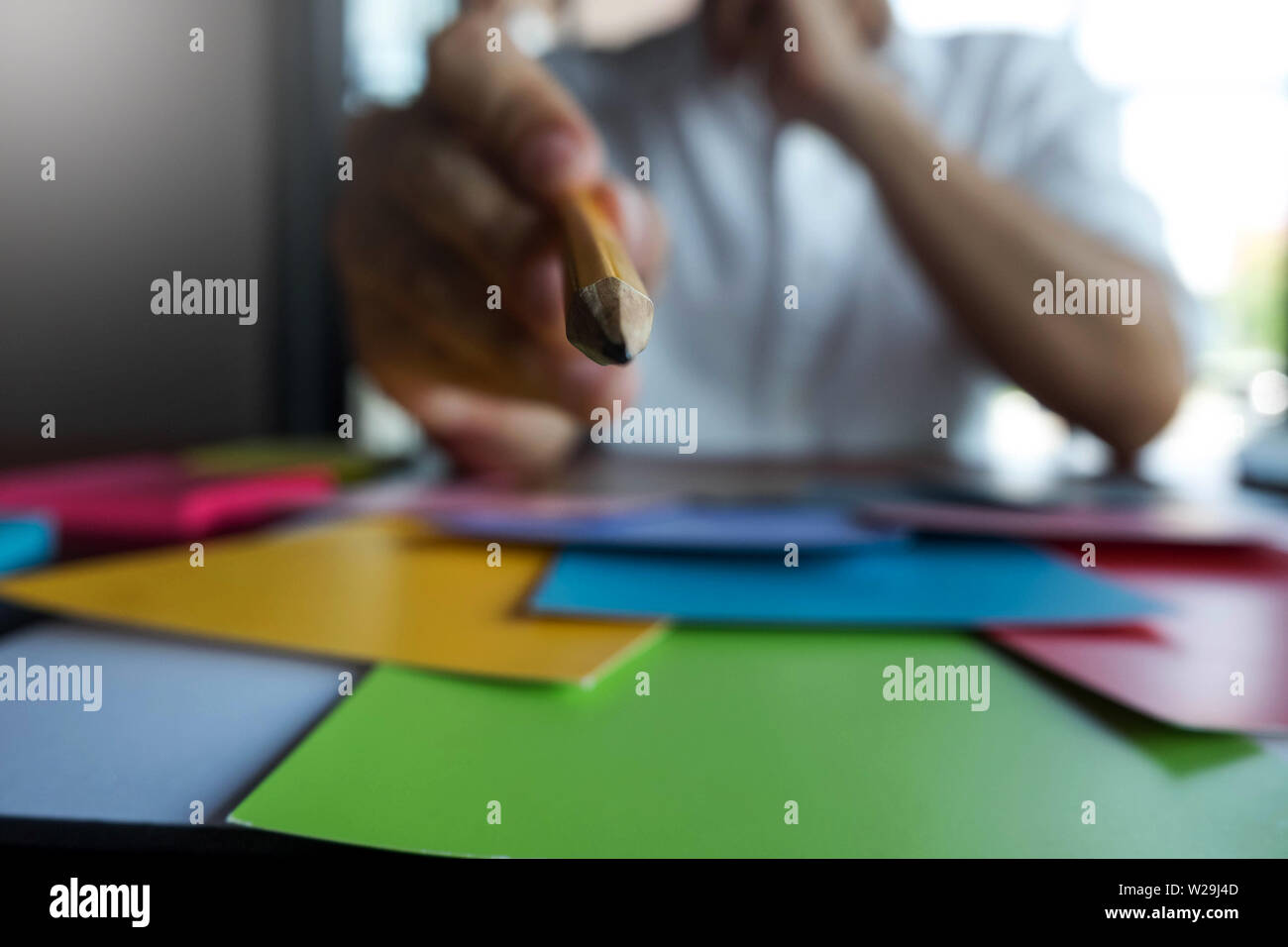 Graphic designer choose colors from the color bands samples for design ...