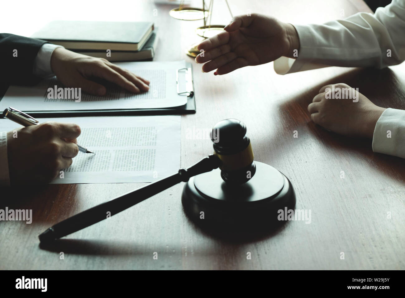Lawyer working with contract client on the table in office. consultant ...