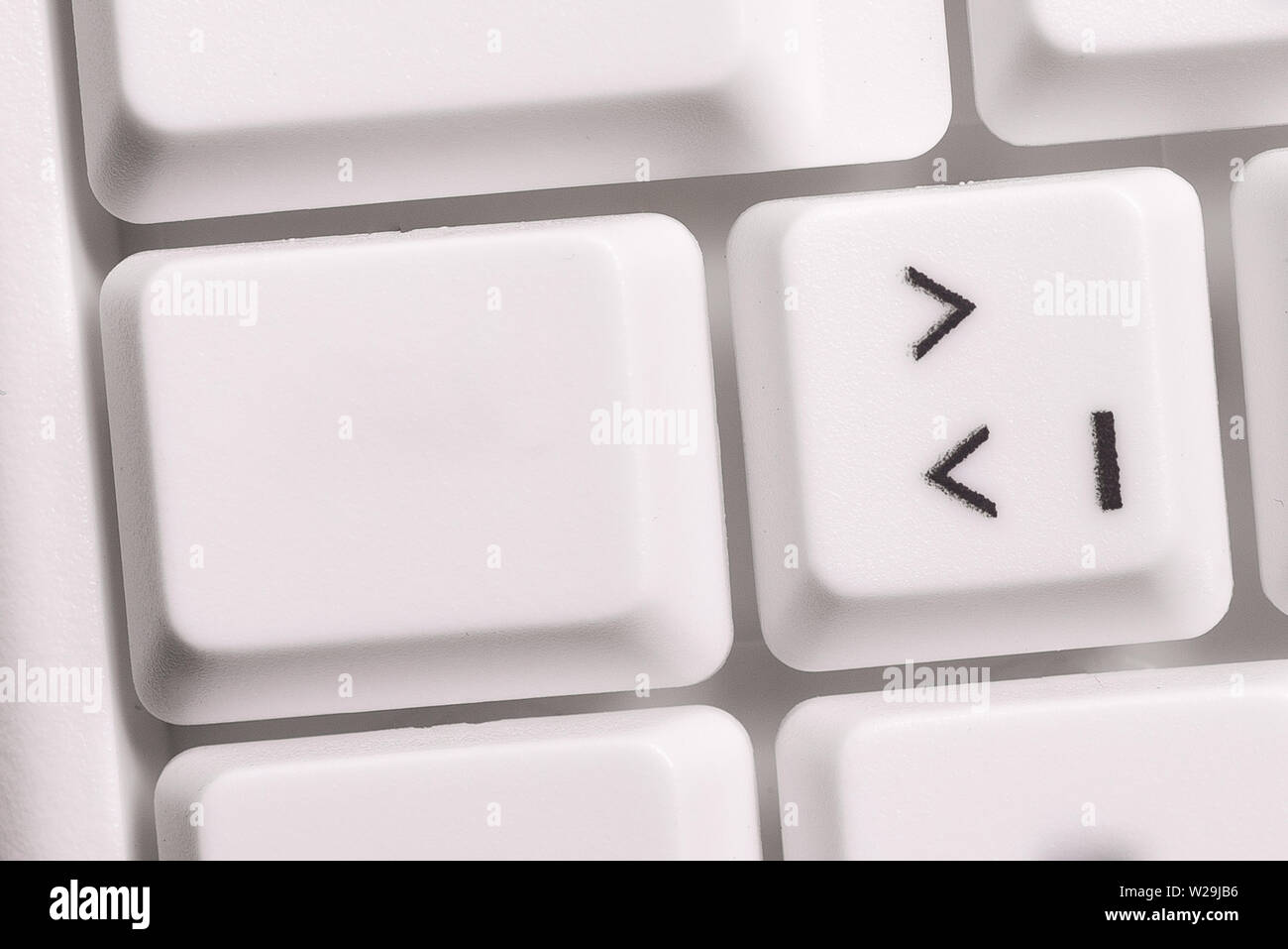 White pc keyboard with empty note paper above white background key copy ...