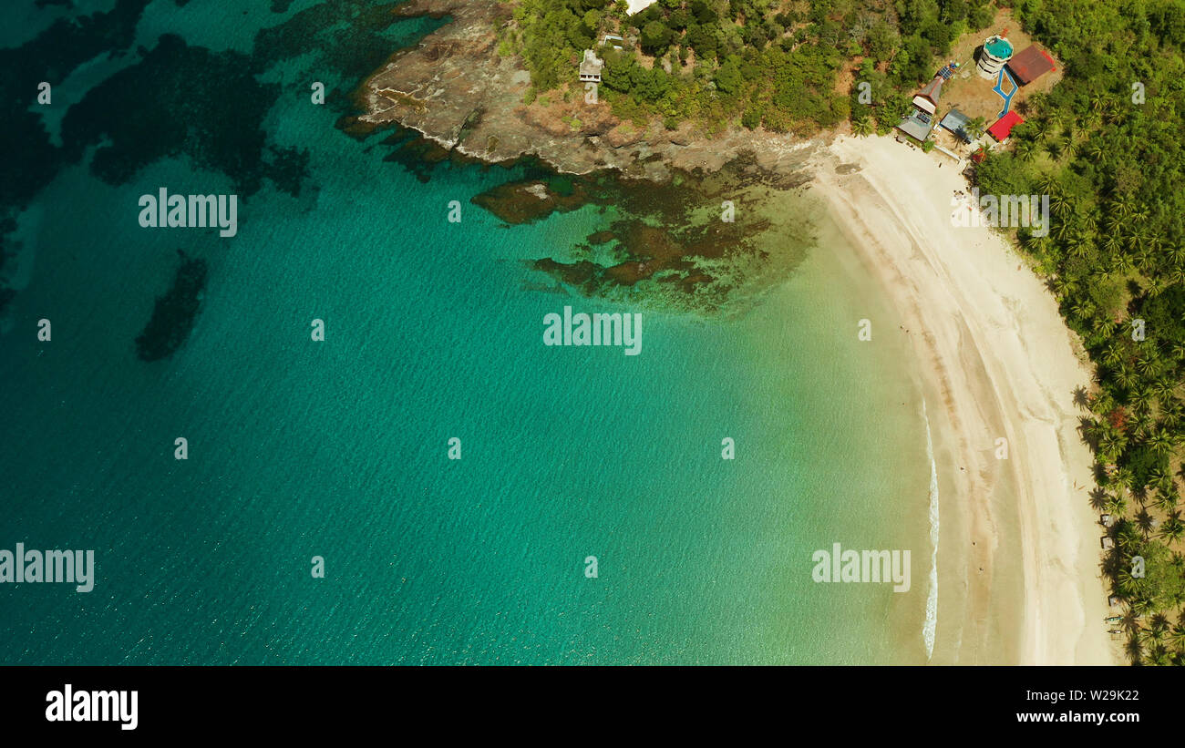 Beautiful tropical beach in cove with blue lagoon and turquoise water ...