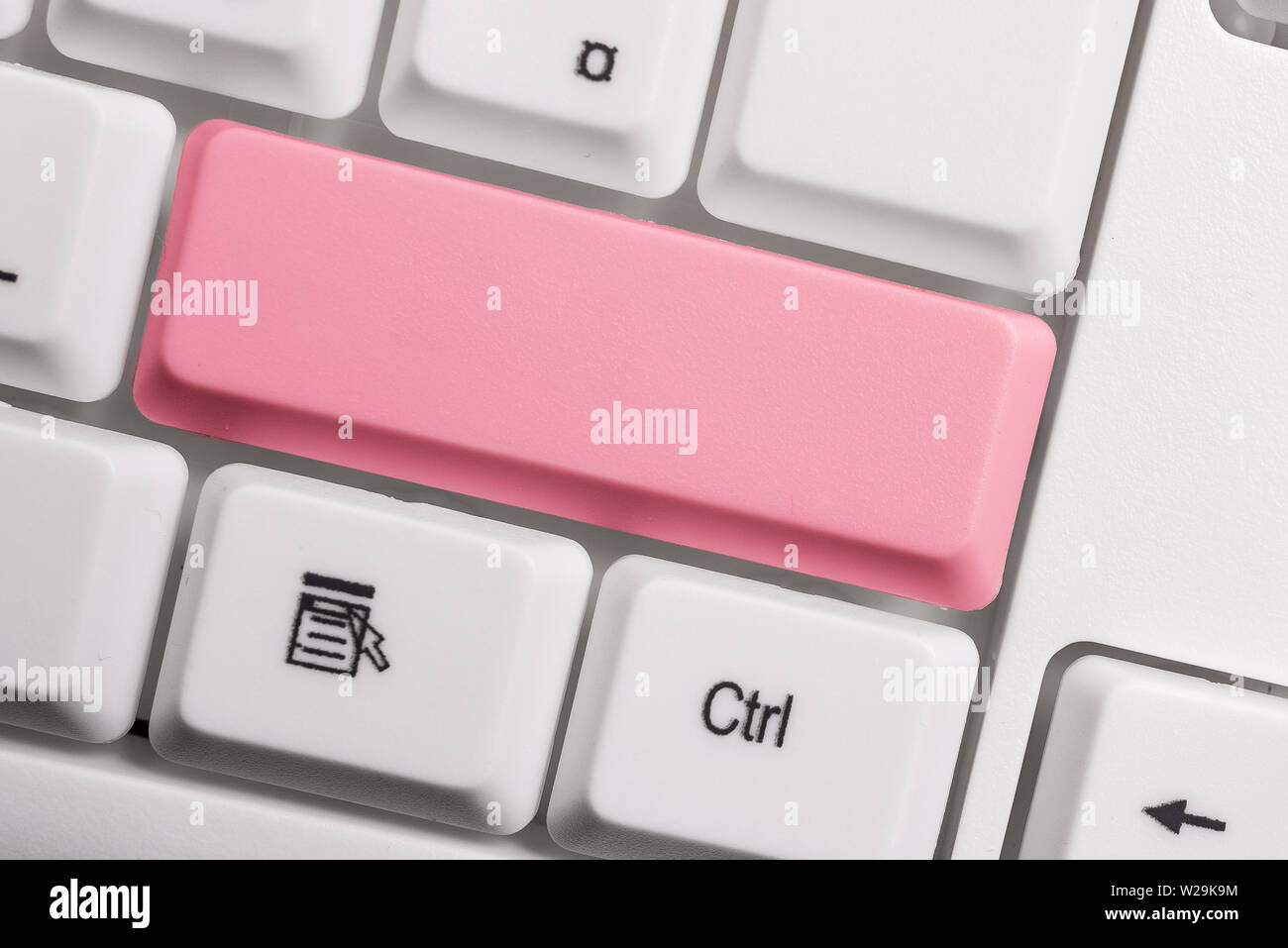 White pc keyboard with empty note paper above white background key copy ...