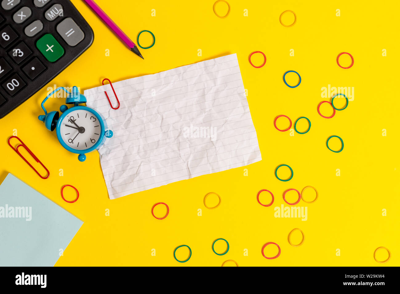 Alarm clock clips note rubber bands calculator pencil colored ...