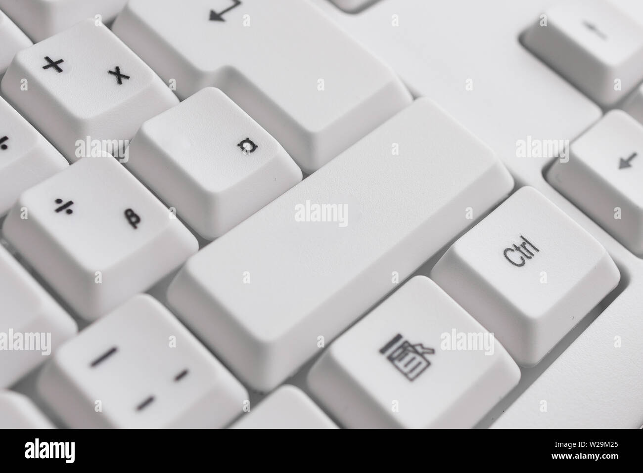 White pc keyboard with empty note paper above white background key copy ...
